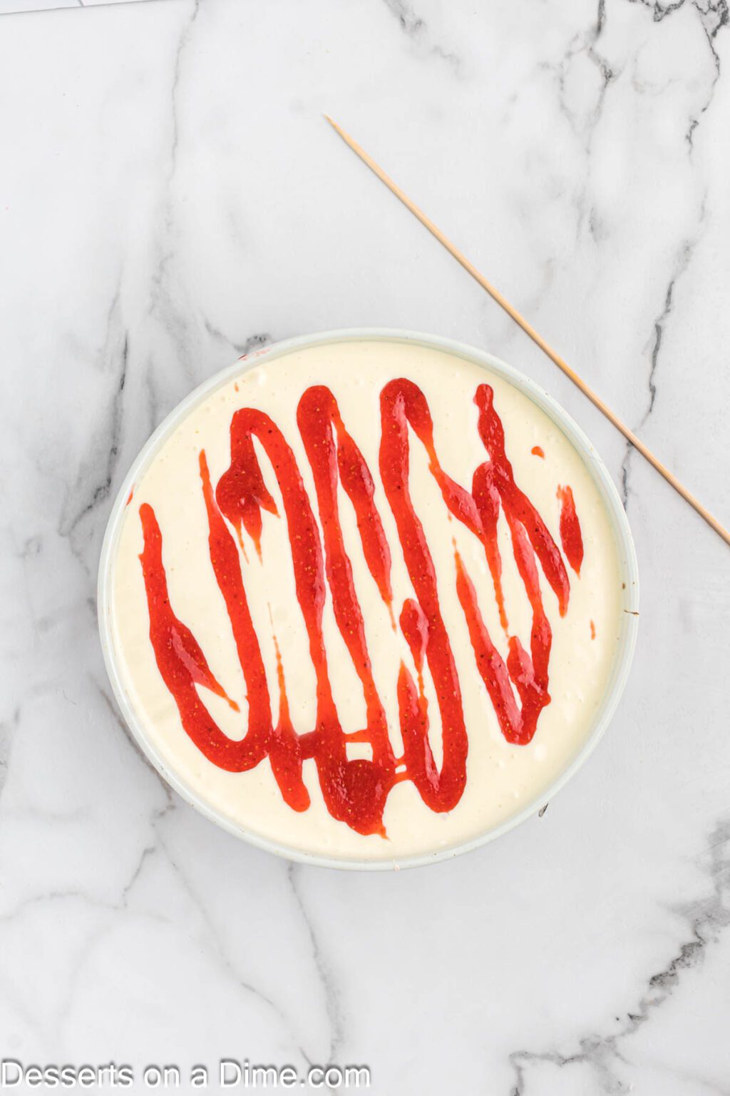 Strawberry Swirl Cheesecake - Desserts on a Dime
