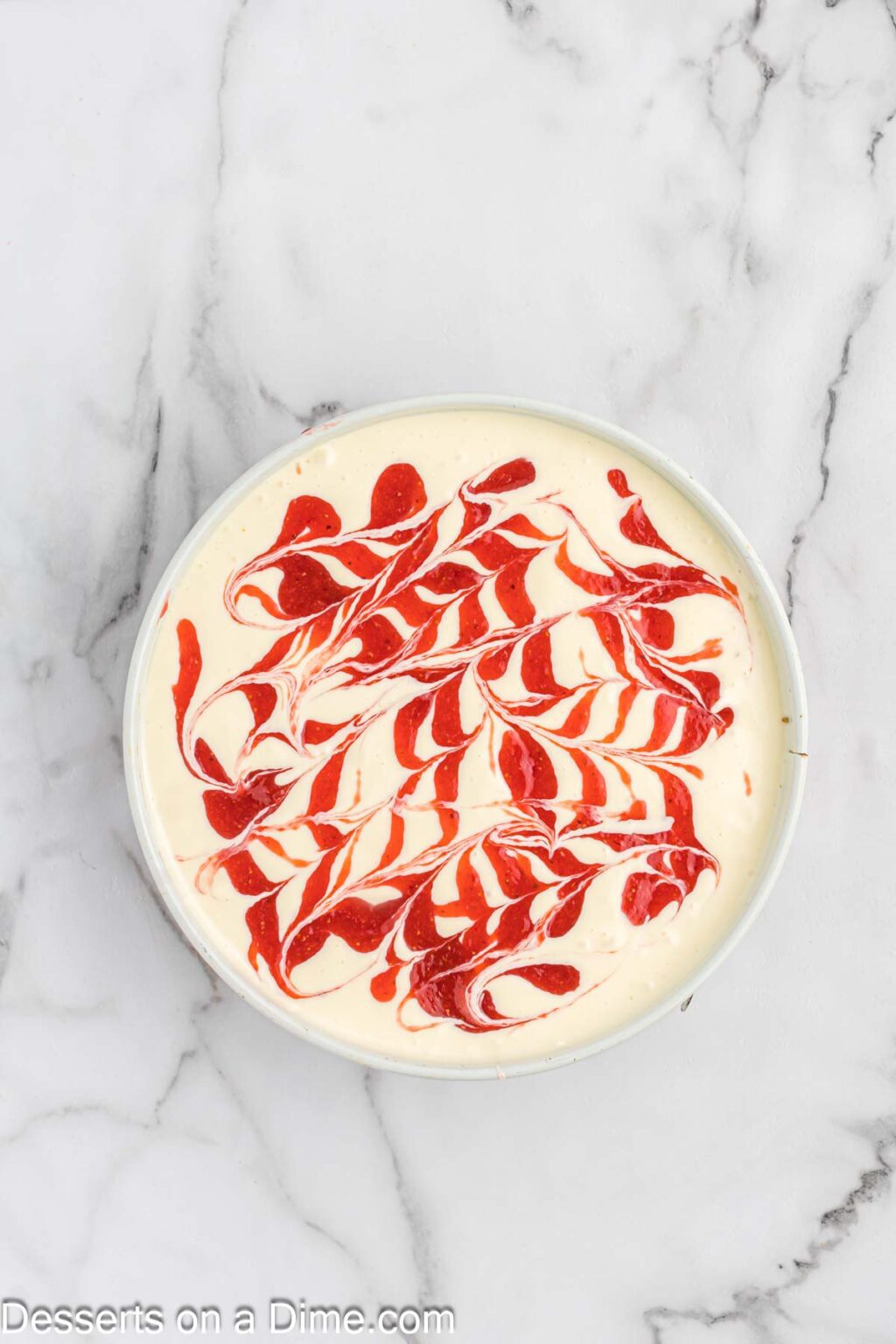Strawberry Swirl Cheesecake - Desserts on a Dime